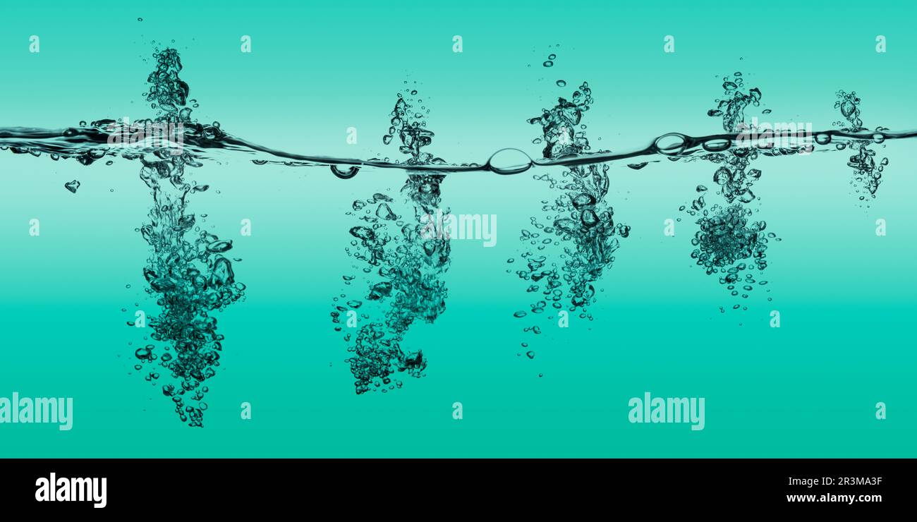 A series of splashes into crystal clear water creating a line of ...