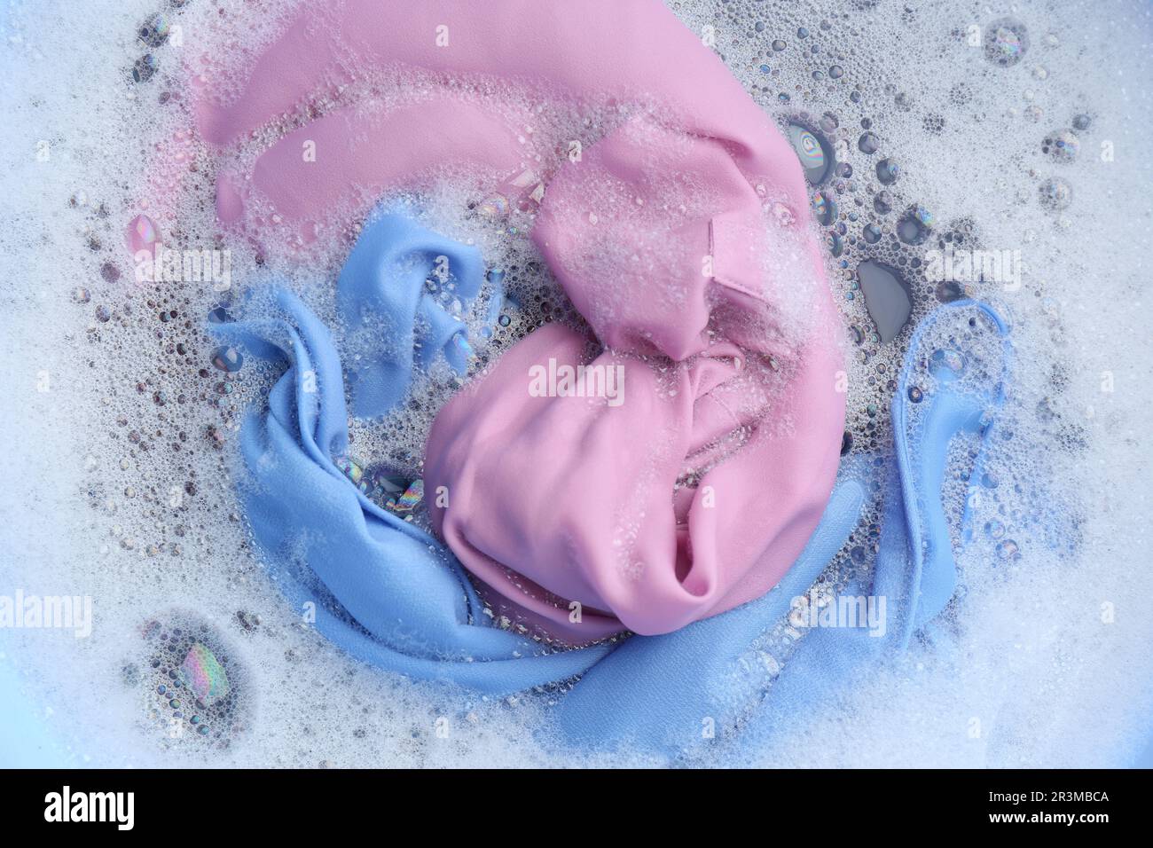 Color clothing in suds, top view. Hand washing laundry Stock Photo - Alamy