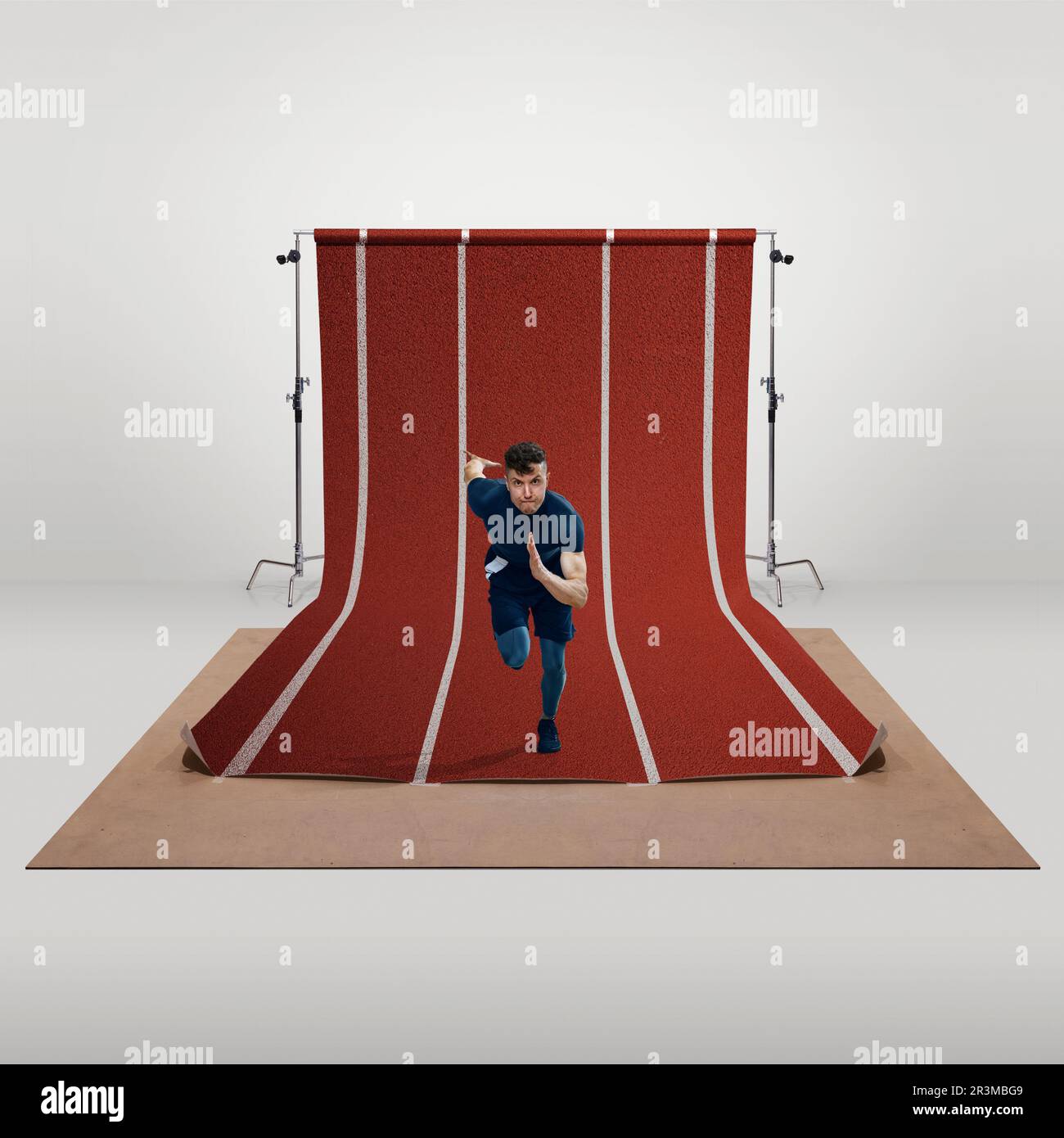 Sportive, athletic man, runner in motion, running on stadium background ...