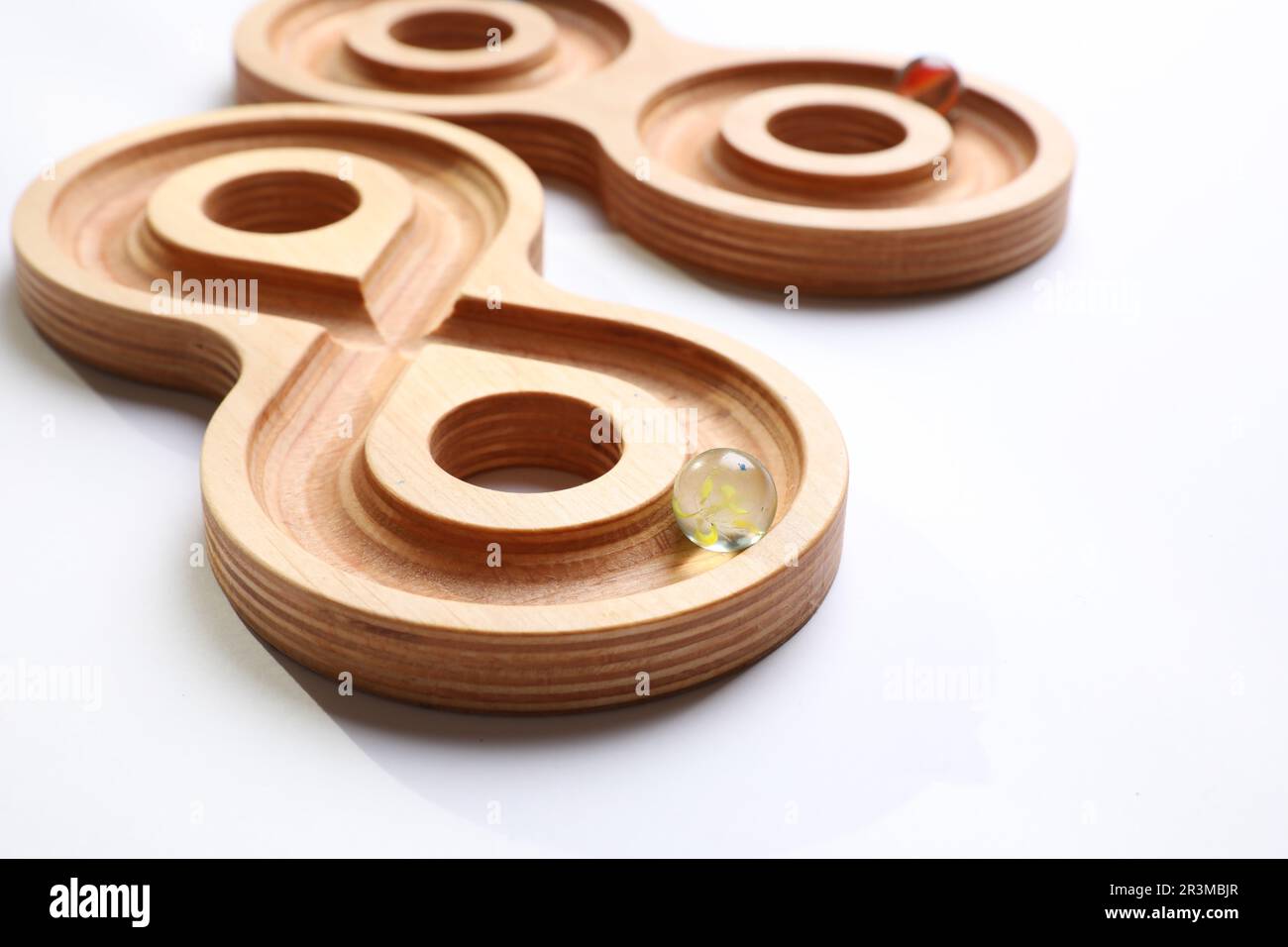 Labyrinth balance boards on white background, closeup. Montessori toy ...