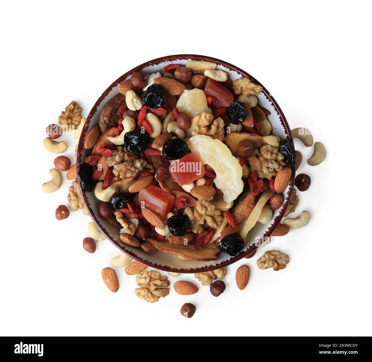 Bowl with mixed dried fruits and nuts on white background, top view Stock Photo - Alamy