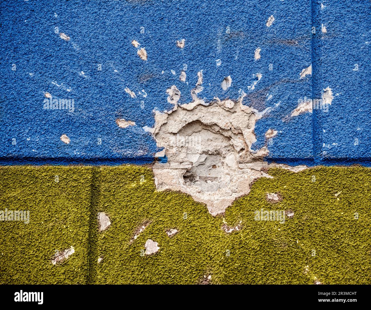 Explosion damaged blue yellow house wall war in Ukraine Stock Photo - Alamy