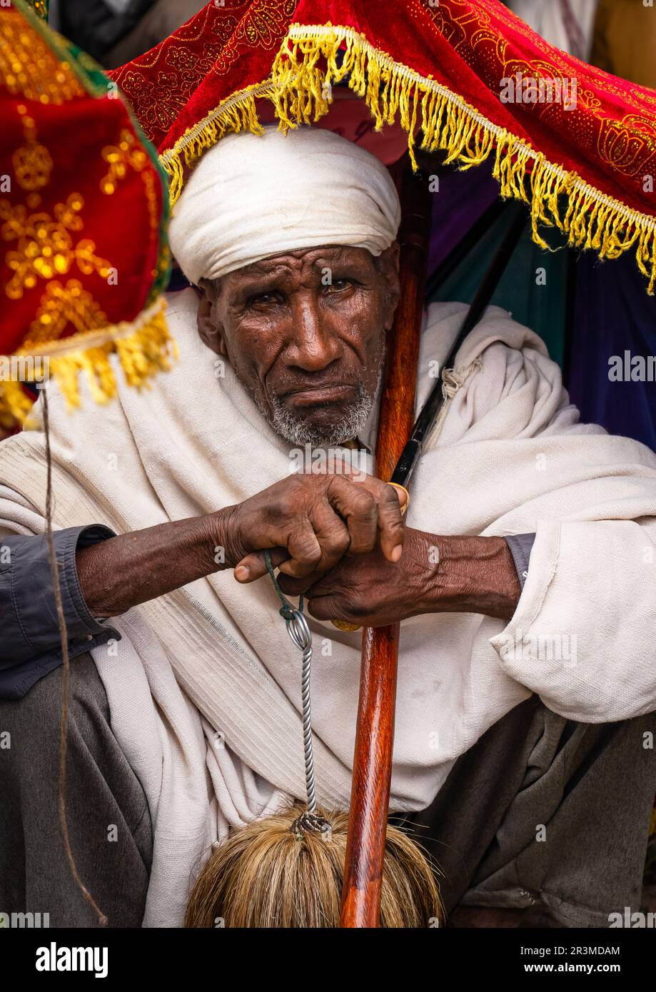 Ethiopian man under an umbrella during a celebration in Bilbaia Giorgis ...