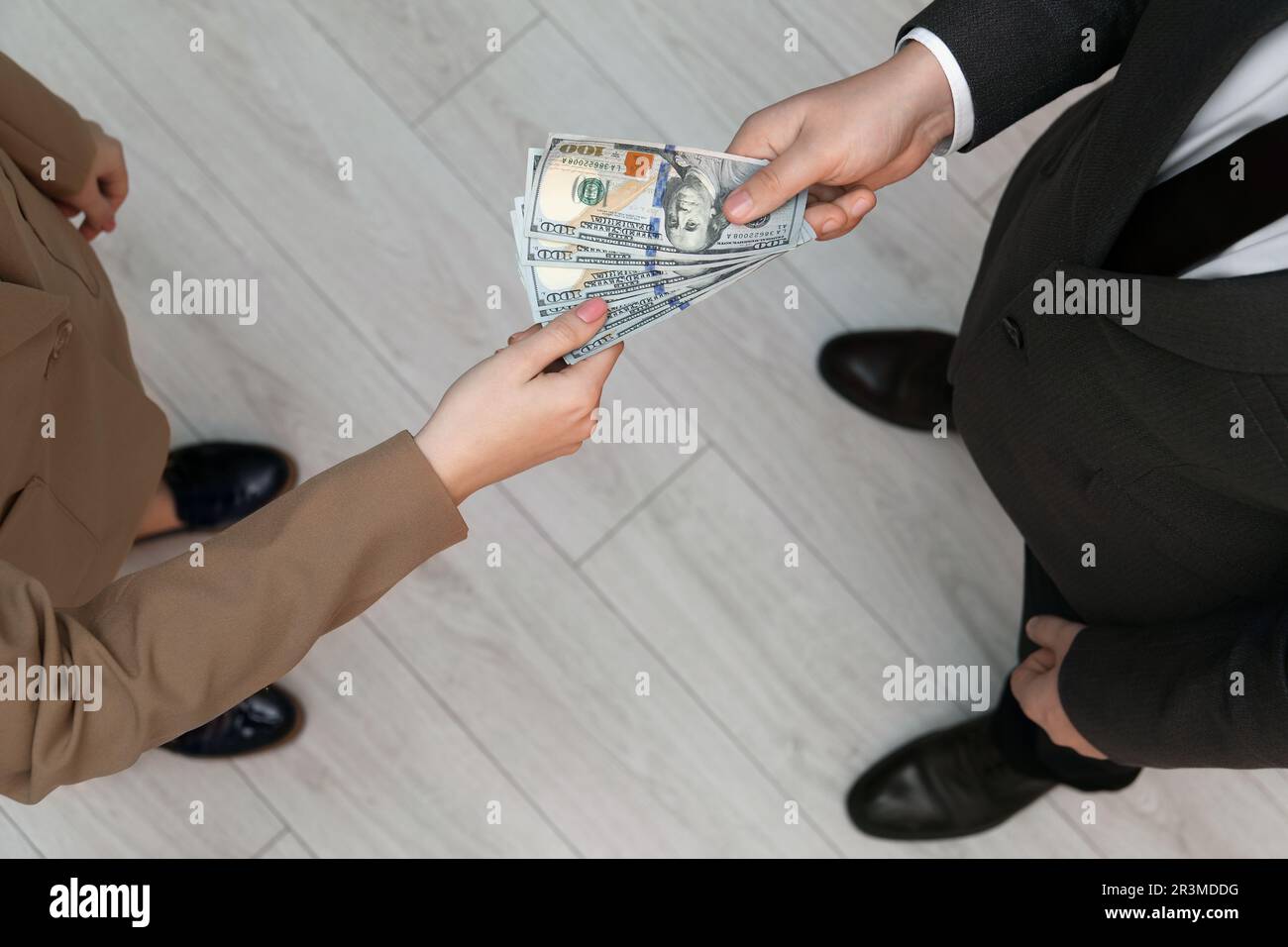 Man giving money to woman indoors, above view. Currency exchange Stock ...