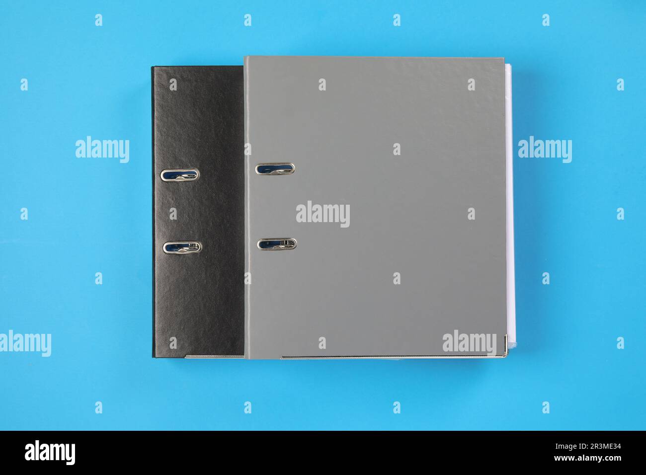 Office folders on light blue background, flat lay Stock Photo - Alamy