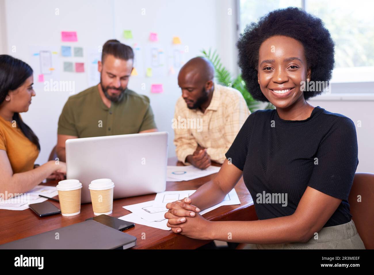 Portrait of young Black woman, mobile app design, creative coding team ...