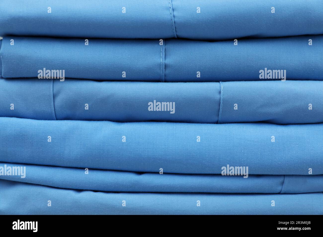 Light blue medical uniforms as background, closeup Stock Photo - Alamy