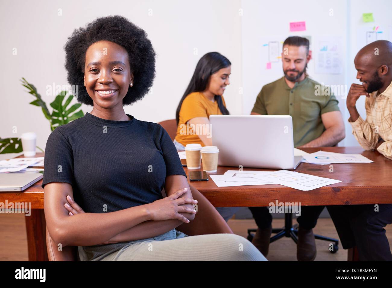 Portrait of young Black woman, mobile app design, creative coding team ...