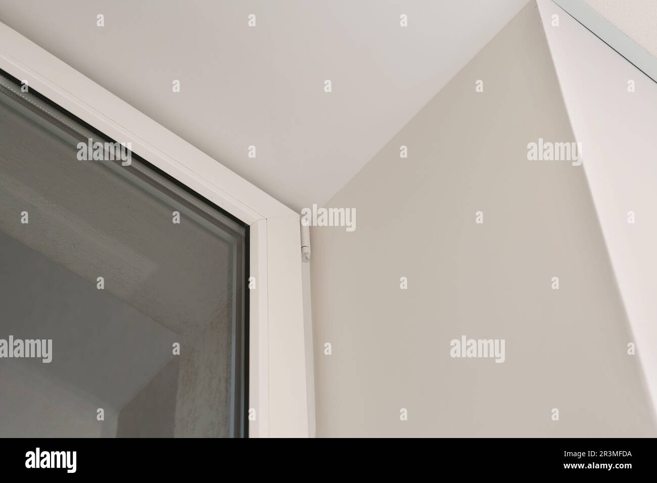 Glass plastic window near white wall indoors, low angle view Stock ...