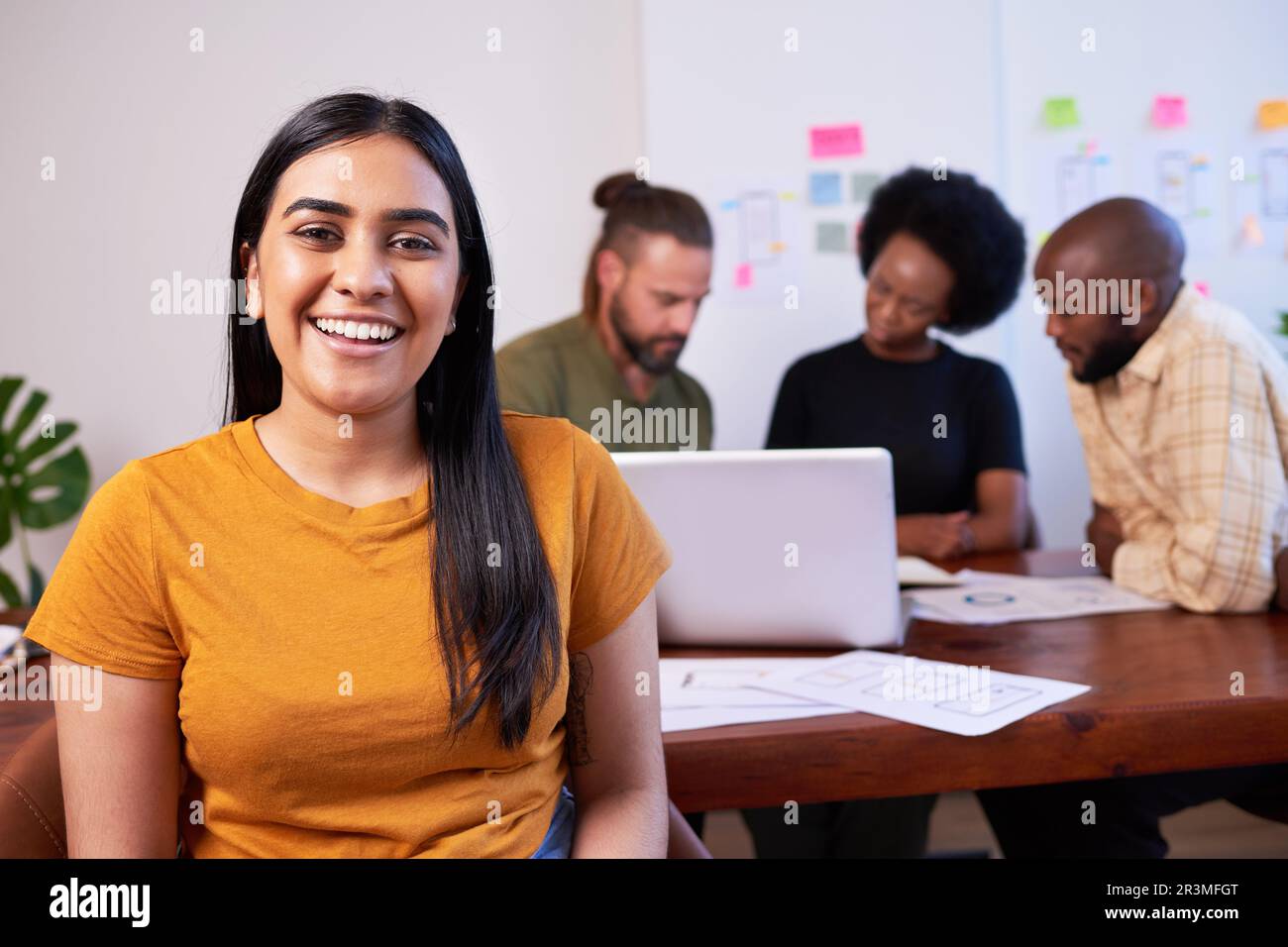 Portrait of young Indian woman, mobile app design, creative coding team Stock Photo - Alamy
