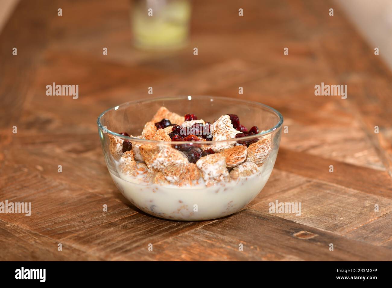 Breakfast cereal with dried cranberries in a glass bowl Stock Photo - Alamy