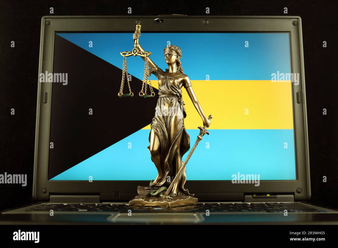 Symbol of law and justice with Bahamas Flag on laptop. Studio shot ...