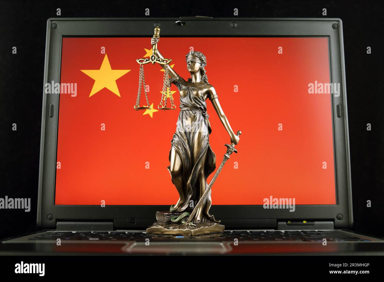 Symbol of law and justice with China Flag on laptop. Studio shot Stock ...