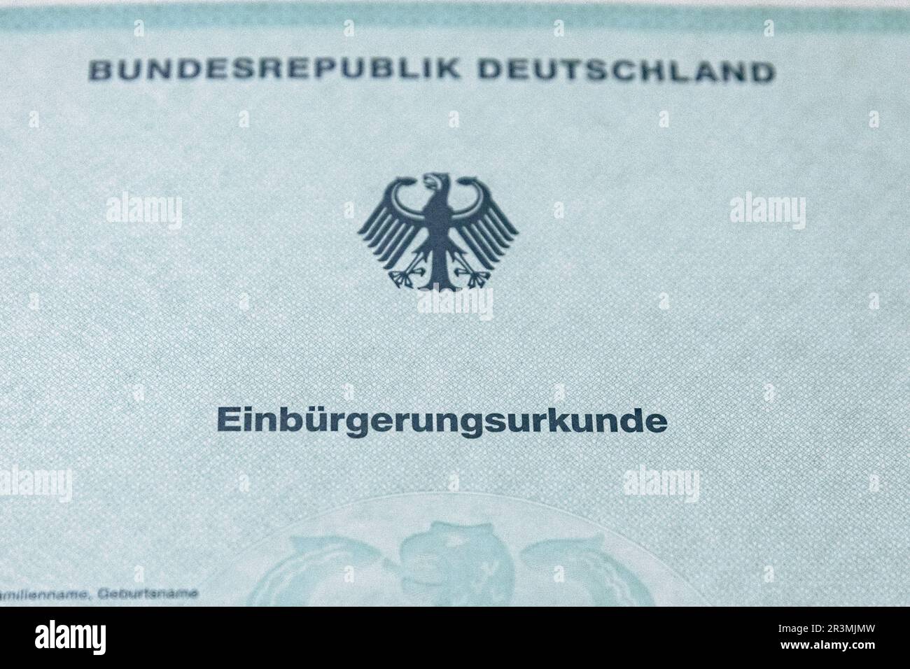 Hamburg, Germany. 23rd May, 2023. A naturalization certificate lies on ...