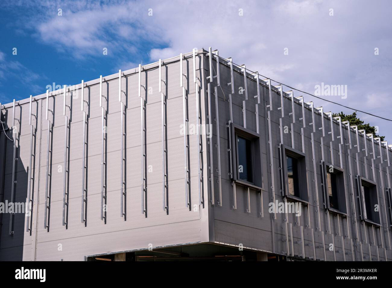 cladding facades with decorative panels. Building house Stock Photo - Alamy