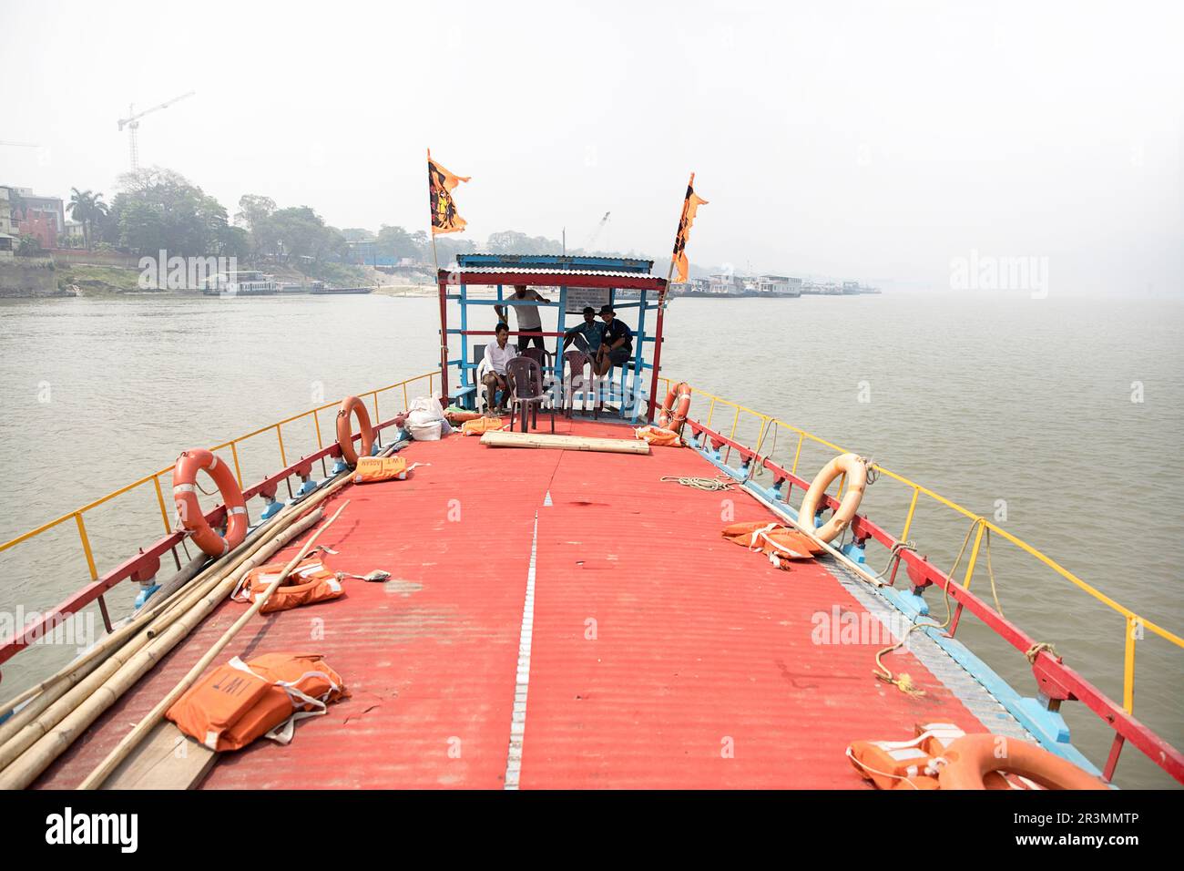 Traditional wooden passenger boat on a Brahmaputra river near Guwahati ...