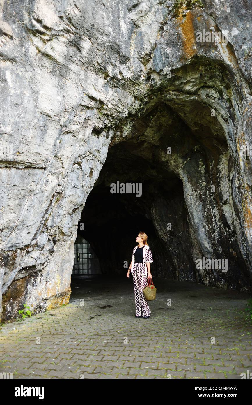 Girl exploring cave in the mountain Stock Photo - Alamy