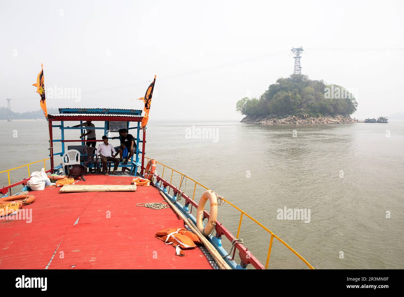Traditional wooden passenger boat on a Brahmaputra river near Guwahati ...