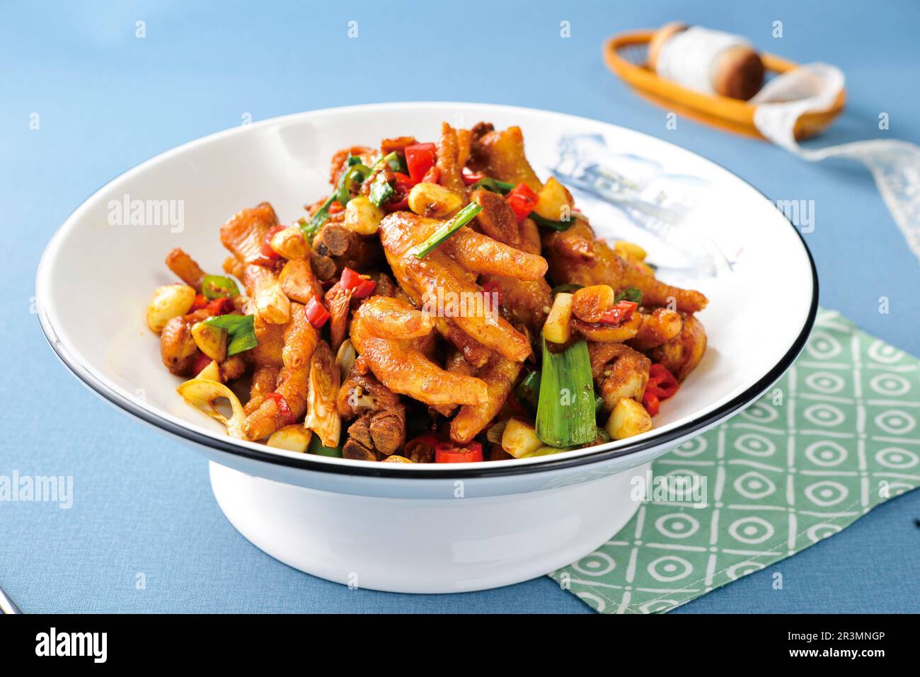 Chicken feet with hot Pepper on retro dark background.Delicious and ...