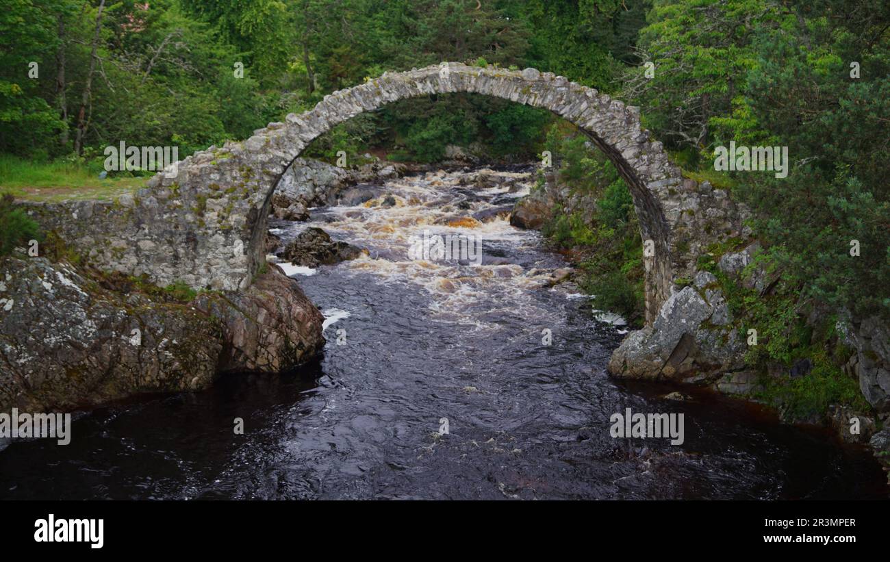 Stone bridge and waterfall in Carrbridge Stock Photo - Alamy