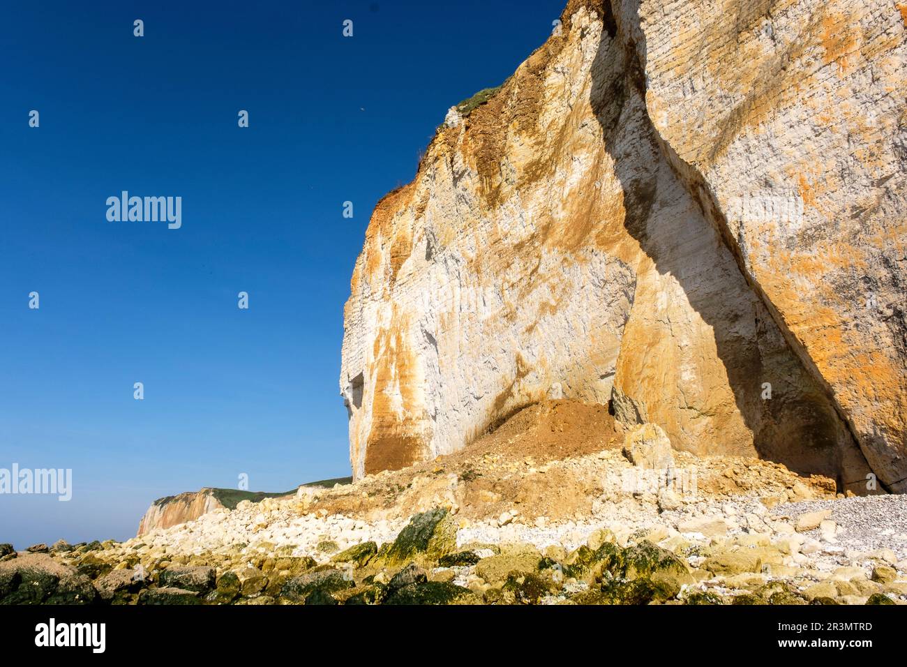 The pebble beach and the cliffs at Saint-Pierre-En-Port - Part of the ...