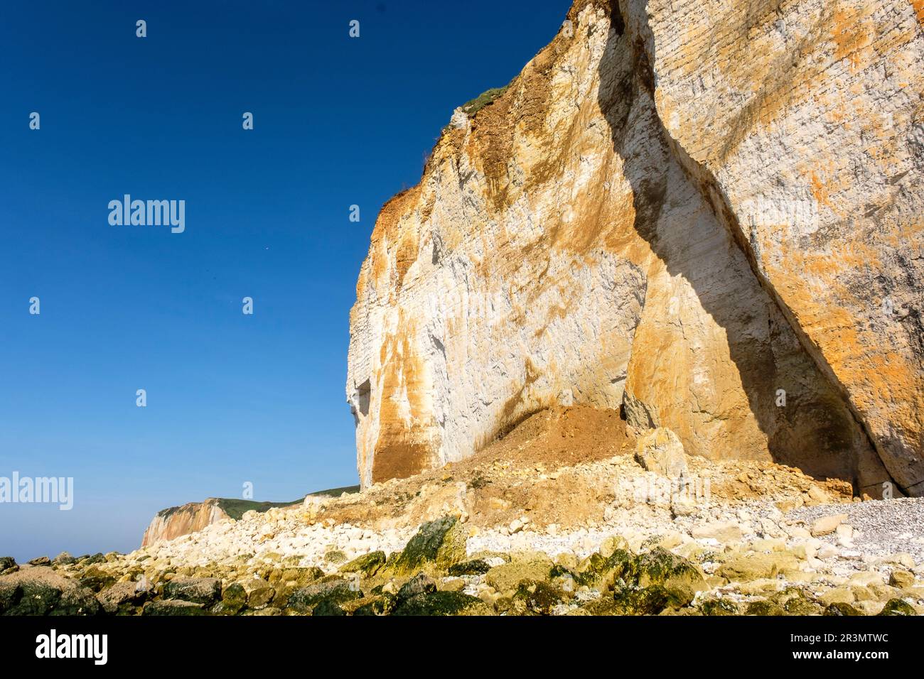 The pebble beach and the cliffs at Saint-Pierre-En-Port - Part of the ...