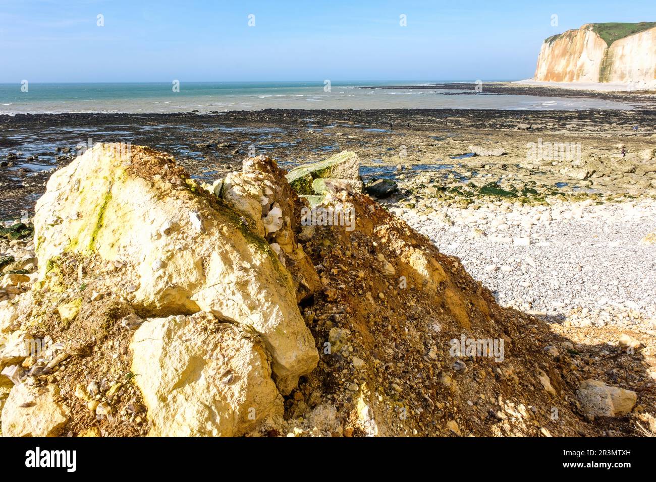 The pebble beach and the cliffs at Saint-Pierre-En-Port - Part of the ...