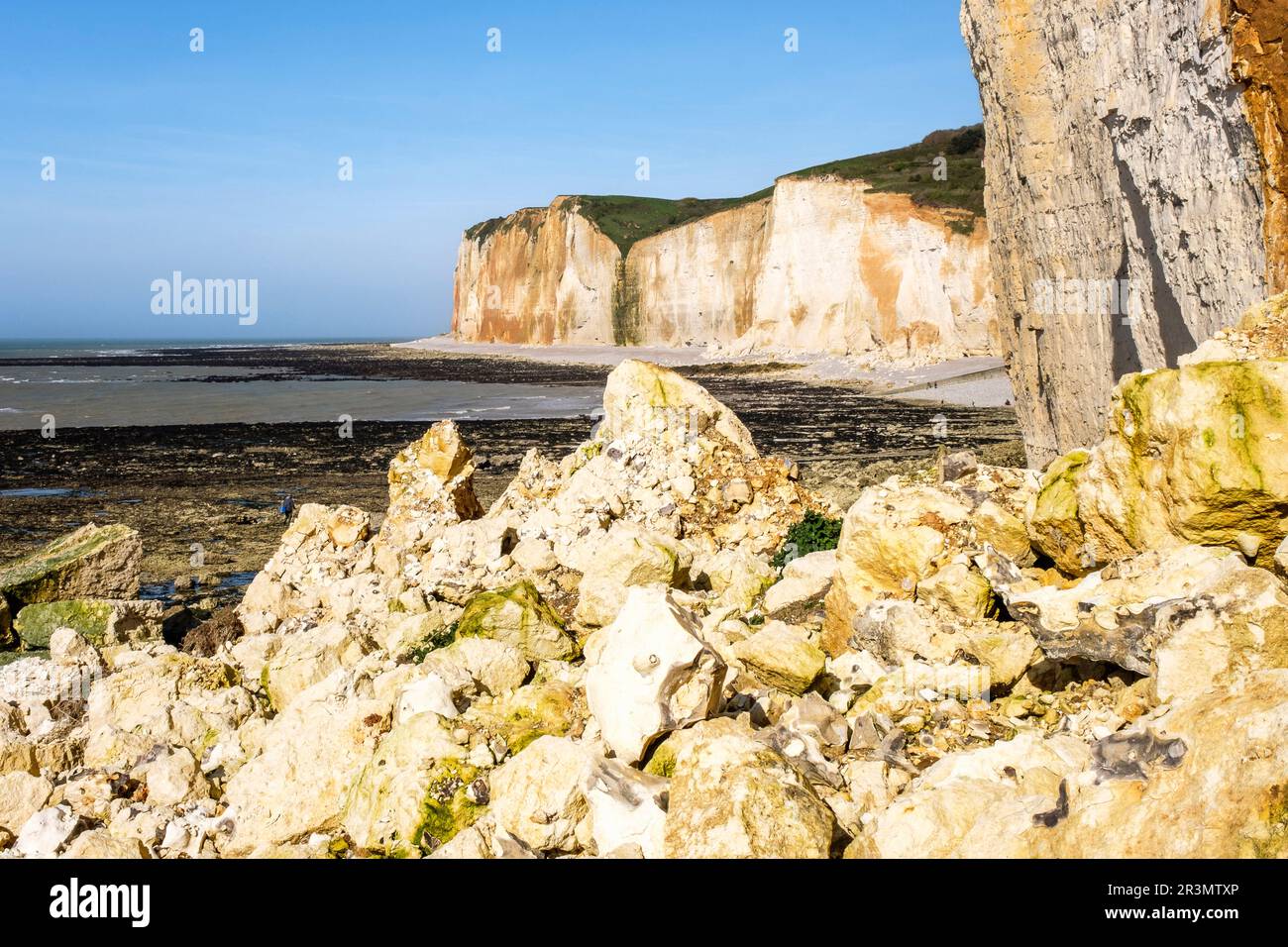 The pebble beach and the cliffs at Saint-Pierre-En-Port - Part of the ...