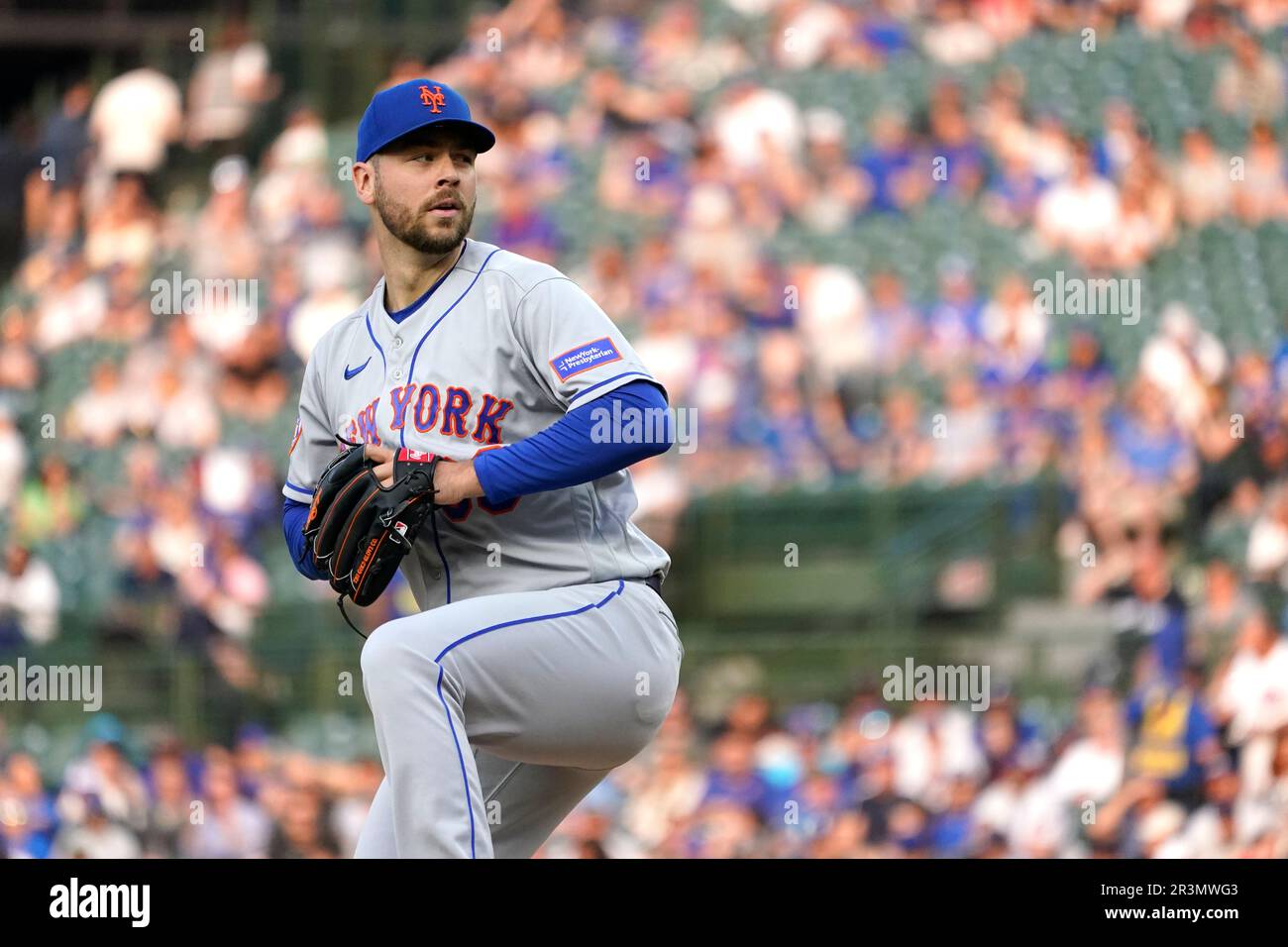 New York Mets starting pitcher Tylor Megill winds up in a baseball game ...