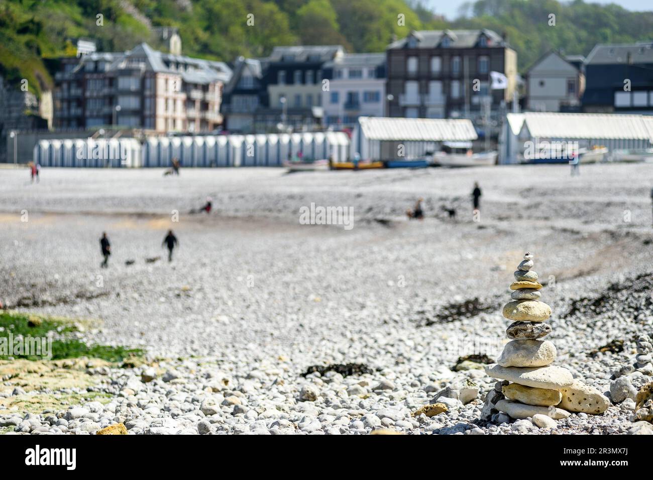 Yport, the pebbles beach, the small boat and the cliffs in front of the ...