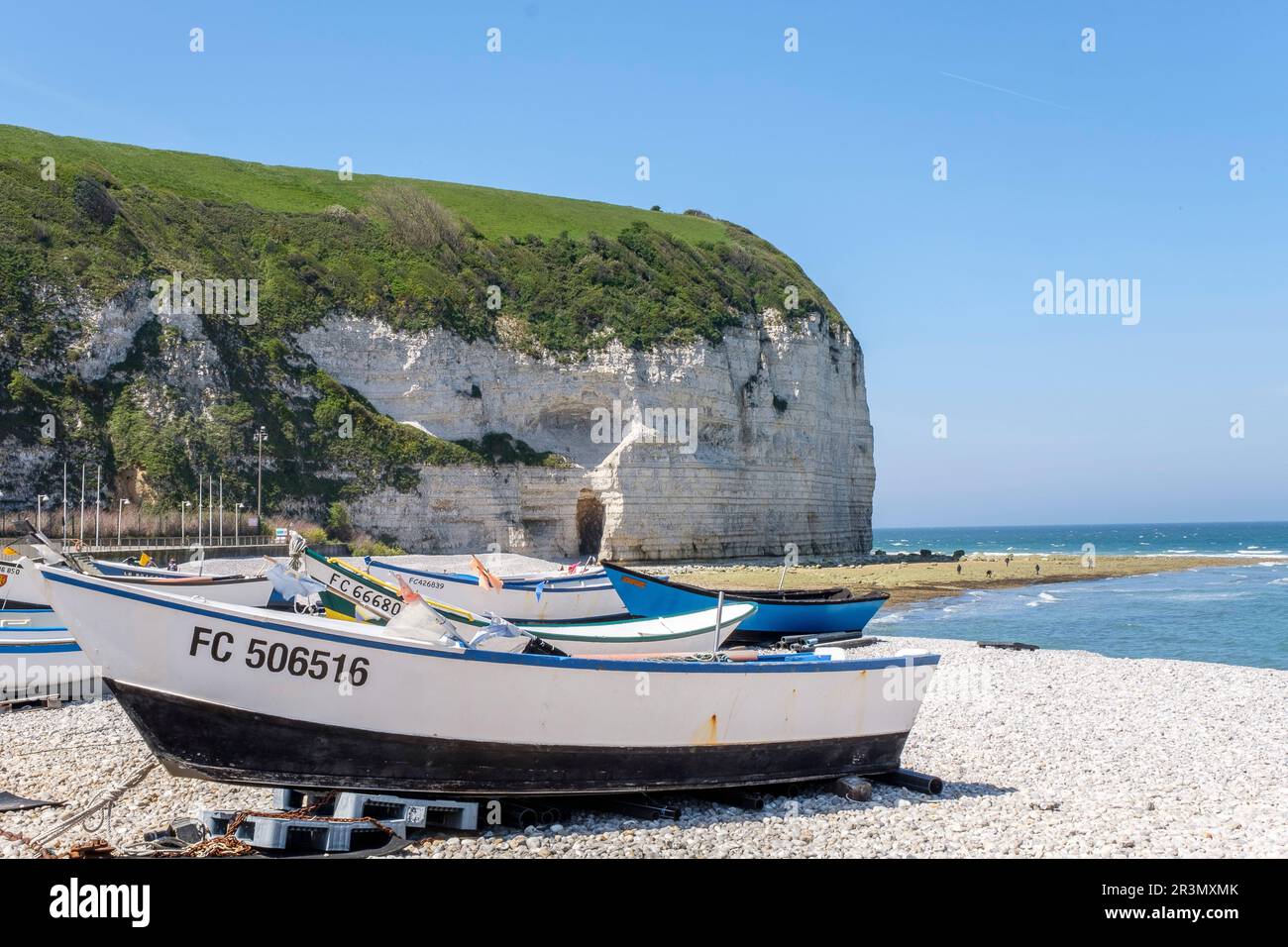 Yport, the pebbles beach, the small boat and the cliffs in front of the ...