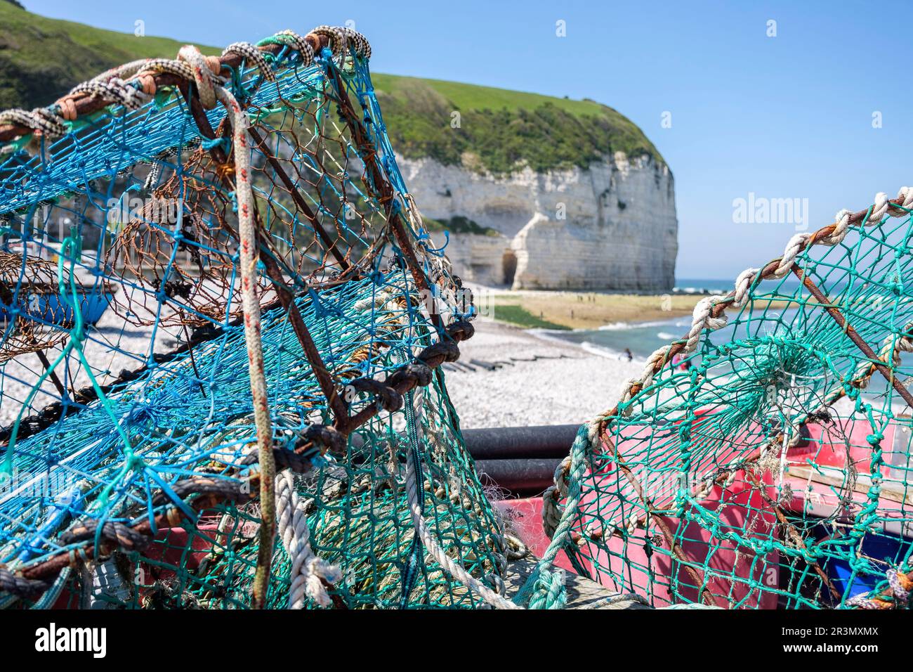 Yport, the pebbles beach, the small boat and the cliffs in front of the ...