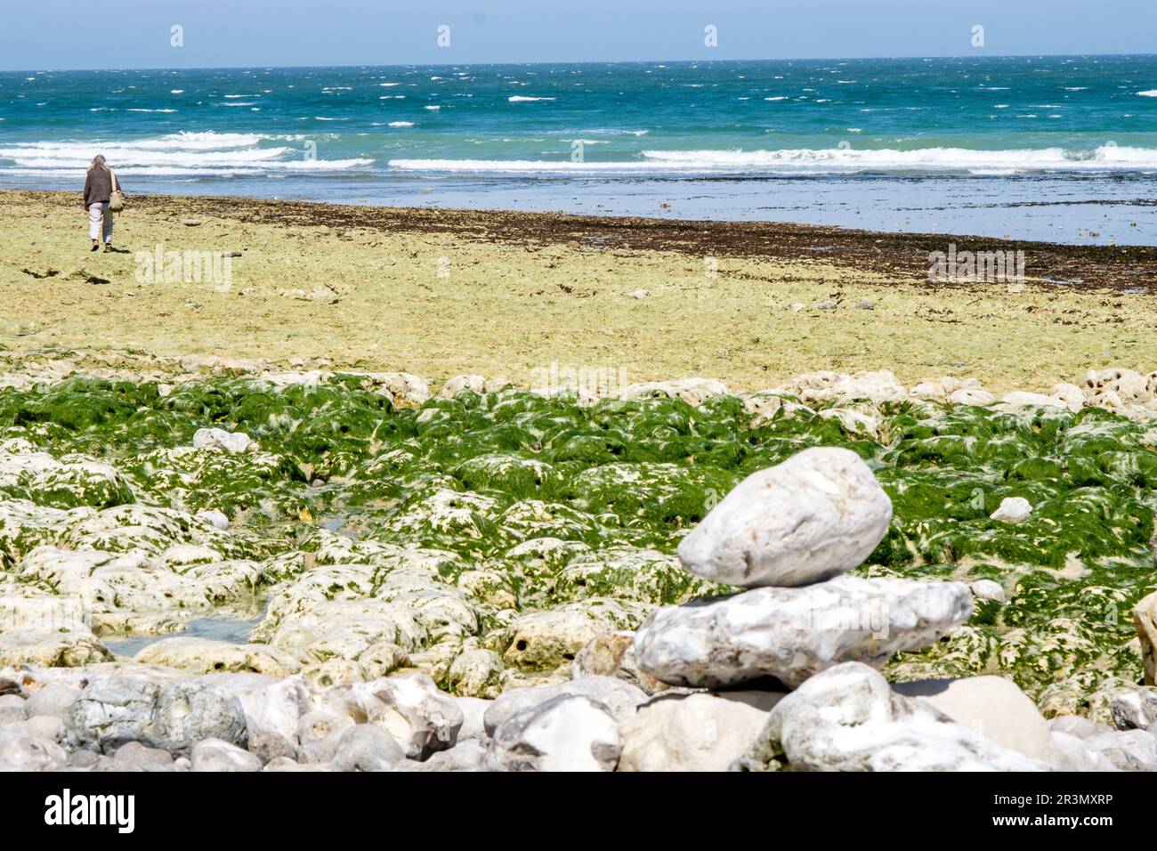 Yport, the pebbles beach, the small boat and the cliffs in front of the ...