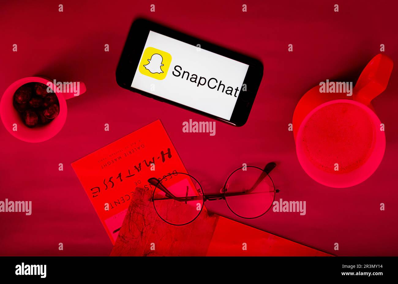 In this photo illustration, the SnapChat logo seen displayed on a ...