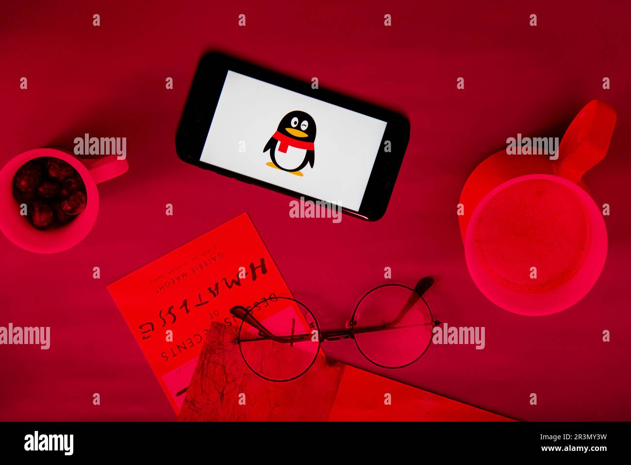 In this photo illustration, the QQ logo seen displayed on a mobile ...
