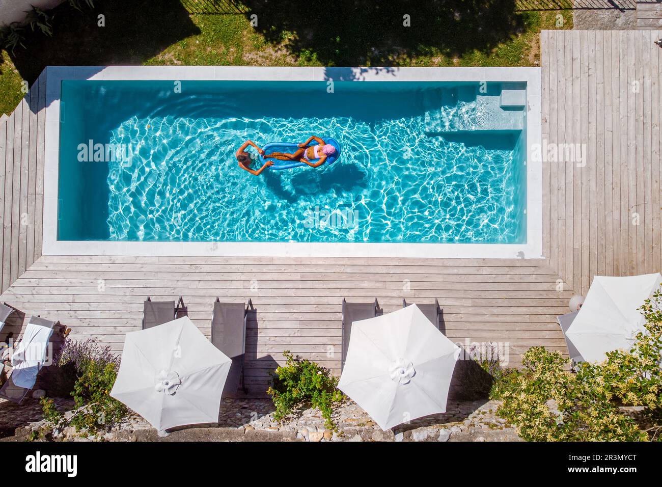 Two person swim in the pool at the hotel. View from above, couple men ...