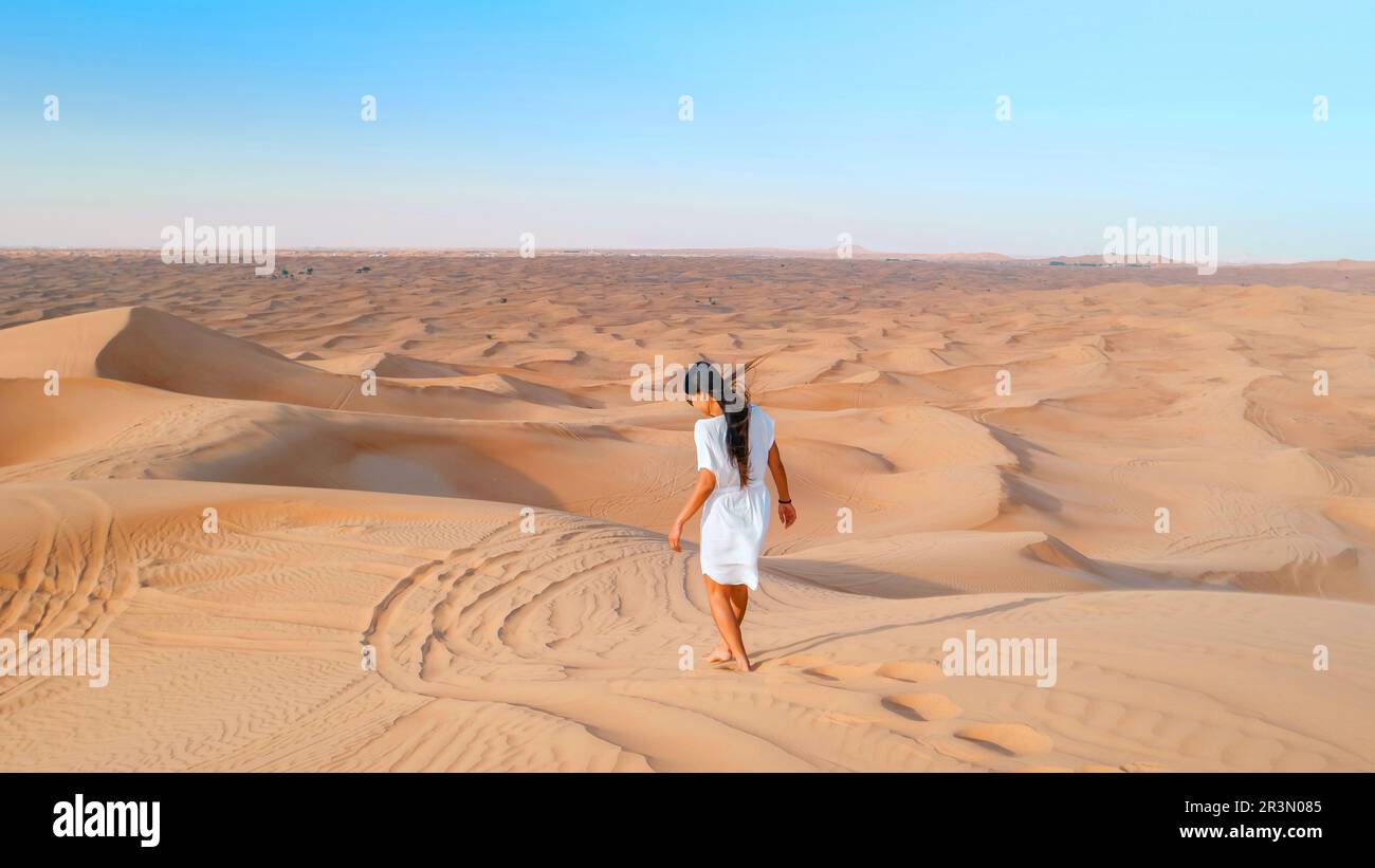 Dubai dessert sand dunes, Asian women on Dubai desert safari,United ...