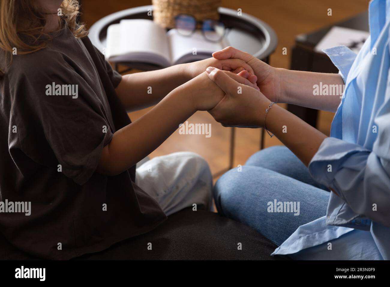 Adult and children's hands together, psychological assistance to the ...