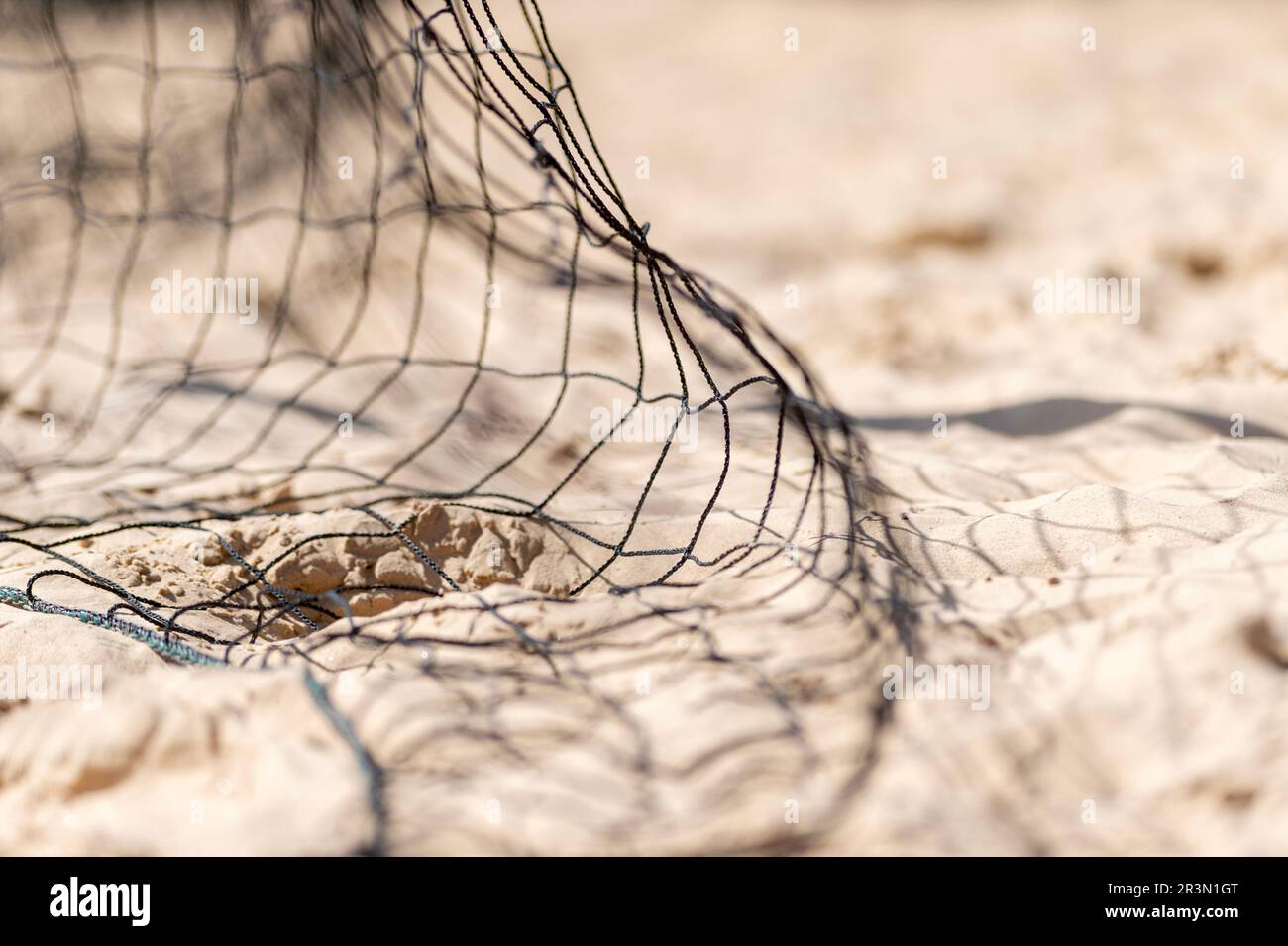 Volleyball net shadows on sand for background design. Sport team ...