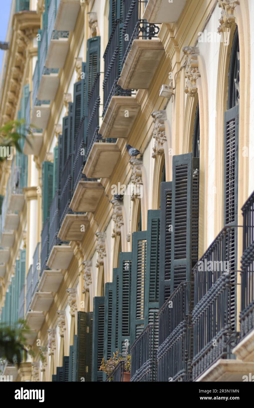 Typical open balconies in buildings of Merced Square, old town of ...
