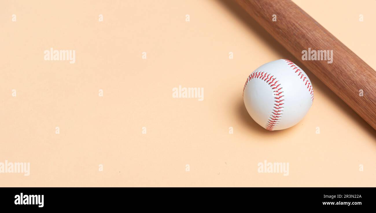 Baseball bat and ball on beige background. Horizontal sport theme ...