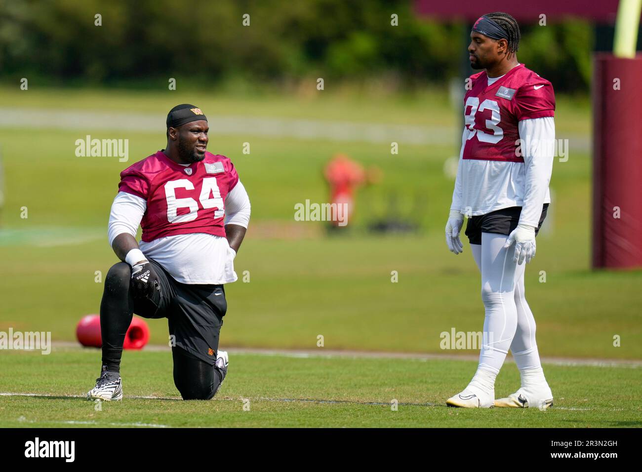 Washington Commanders defensive tackles David Bada (64) and Jonathan ...