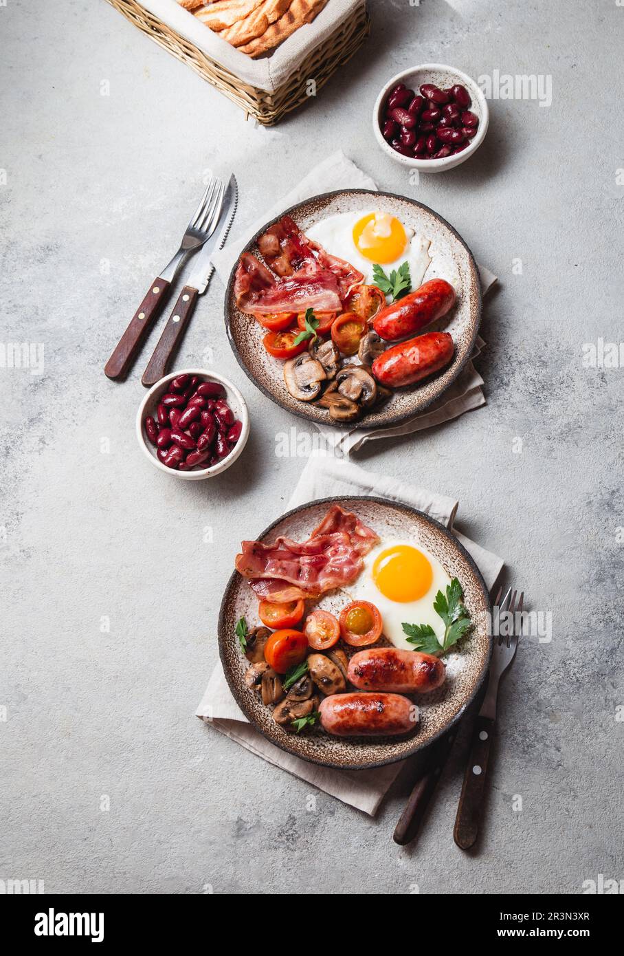 English breakfast on gray plates on white background Stock Photo - Alamy