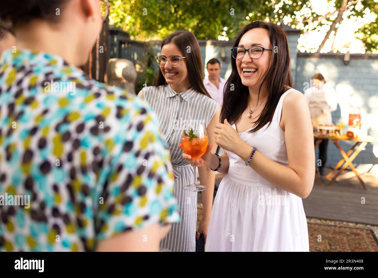 Group of beautiful happy people communicating and smiling while ...
