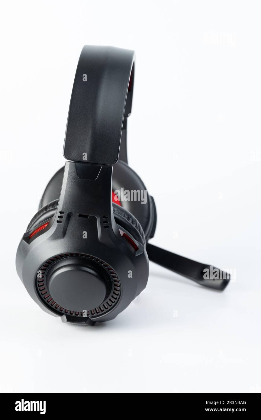 Black headphones with microphone side view isolated on white studio ...