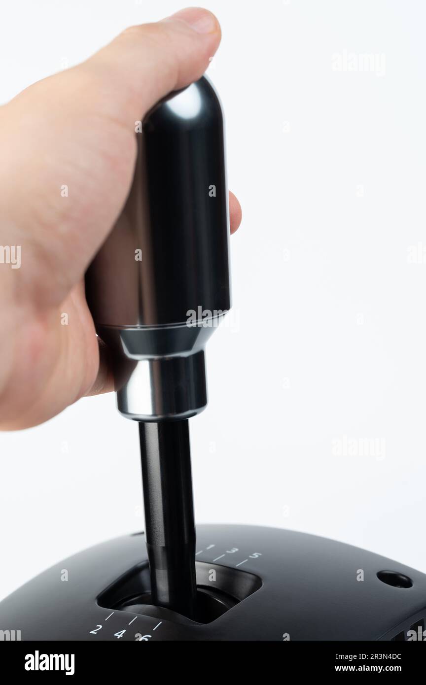 Sport car transmission handle shifter in hand isolated on white studio ...