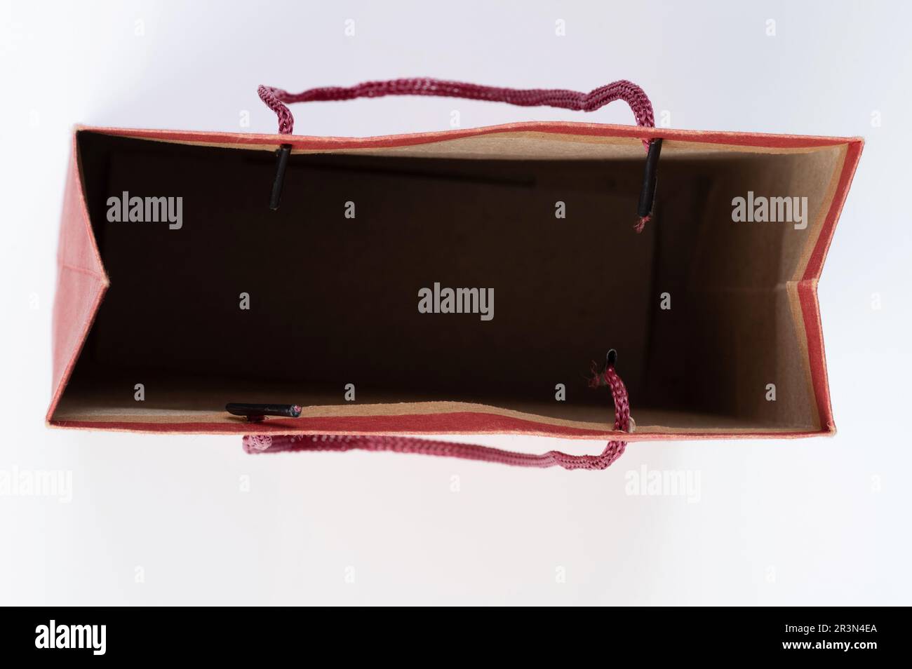 Red paper open bag with handles above top view isolated Stock Photo - Alamy