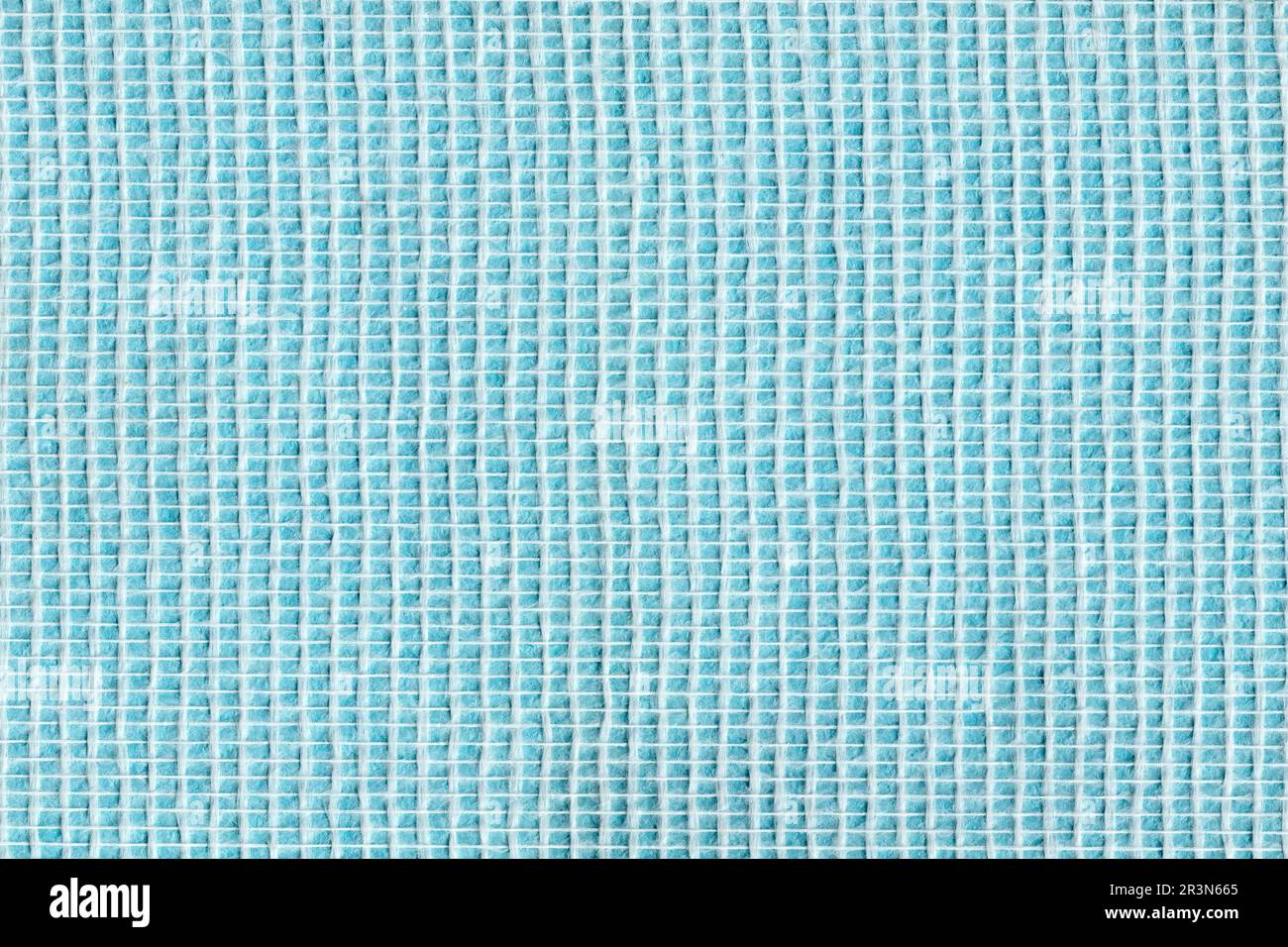 Woven glass fiber wallpaper against a blue background Stock Photo - Alamy
