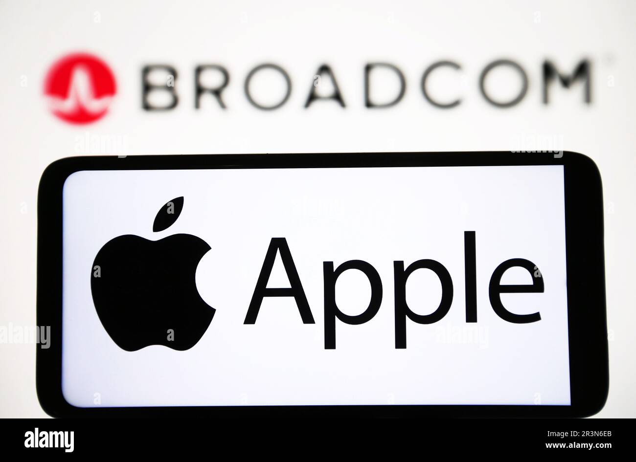 In this photo illustration, Apple logo is seen on a smartphone and ...