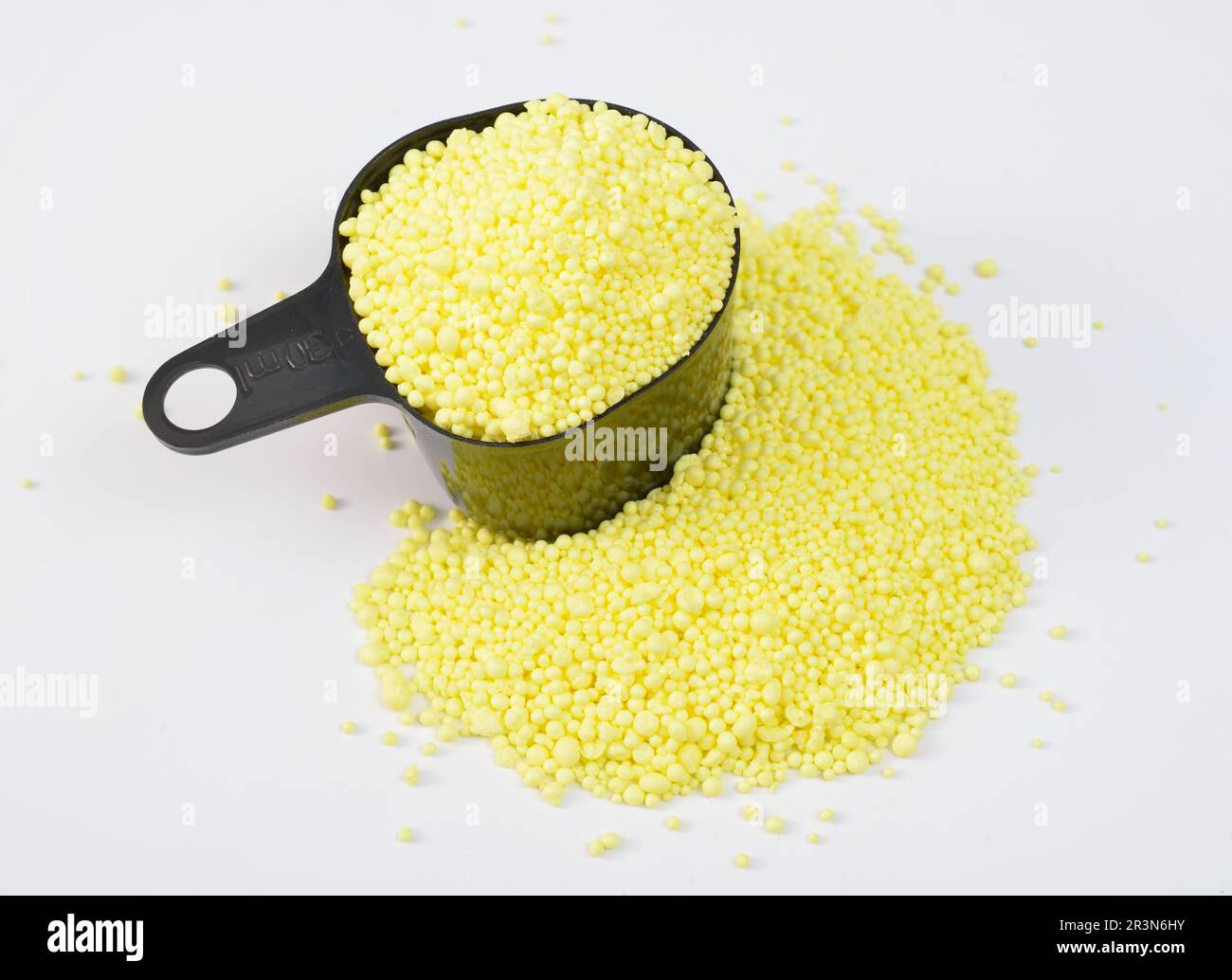 Granulated Sulfur or sulphur on white background Stock Photo - Alamy